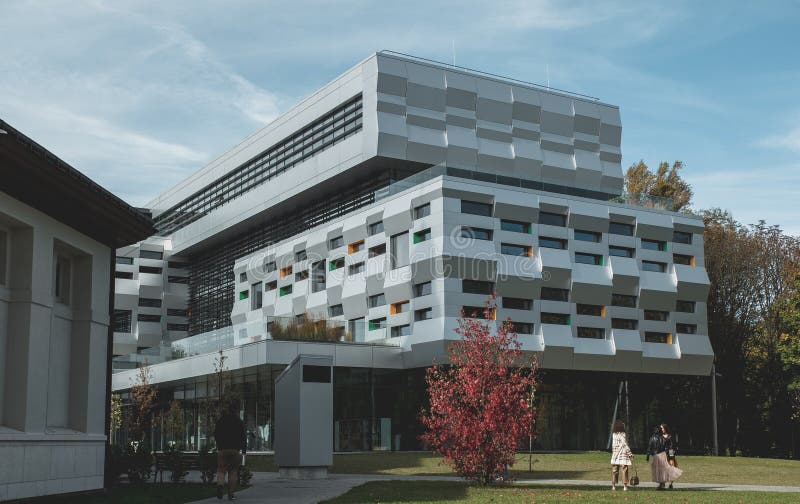 Modern White Building Surrounded with a Green Lawn during Daytime ...