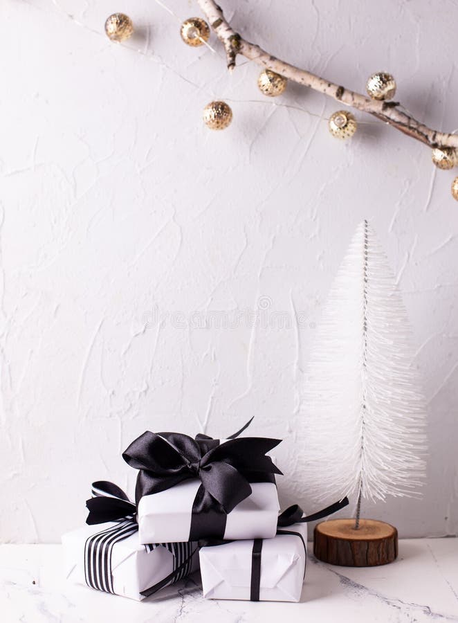 Modern White Decorative Christmas Tree and Group of Wrapped Boxes Stock ...