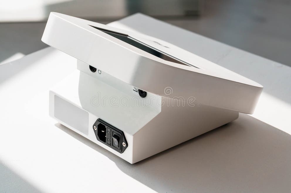 Modern White Electronic Device with Open Lid Featuring Power Switch and Connector on ...