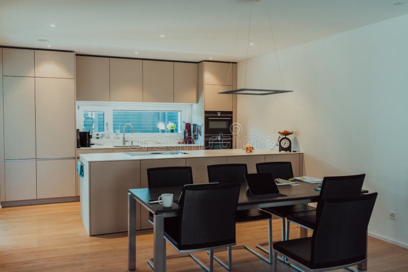 Modern White Kitchen with Electronic Devices and Decorative Items Stock ...