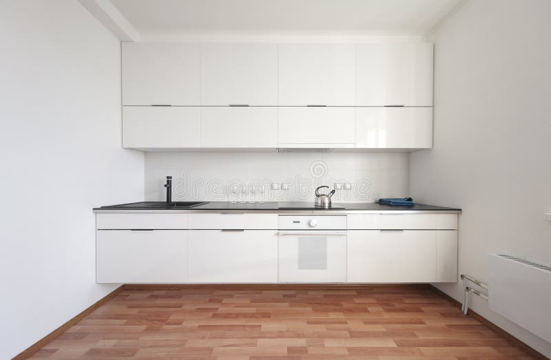 White Cabinets in Bright Modern Kitchen Interior of House with Terrace ...