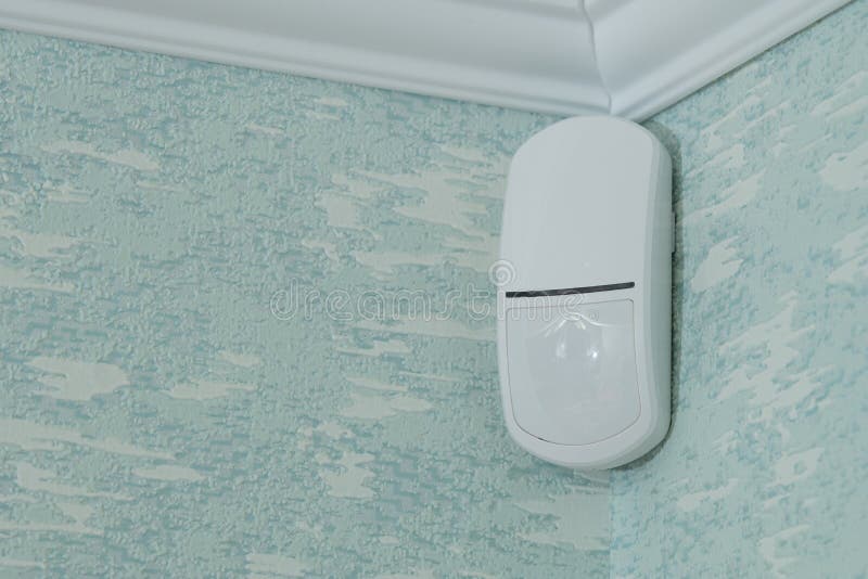 Modern White Motion Sensor on the Wall in the Room. Stock Photo - Image ...