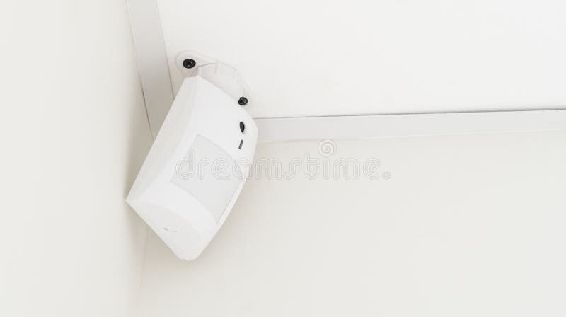 Modern White Motion Sensor on the Wall in the Room. Stock Image - Image ...