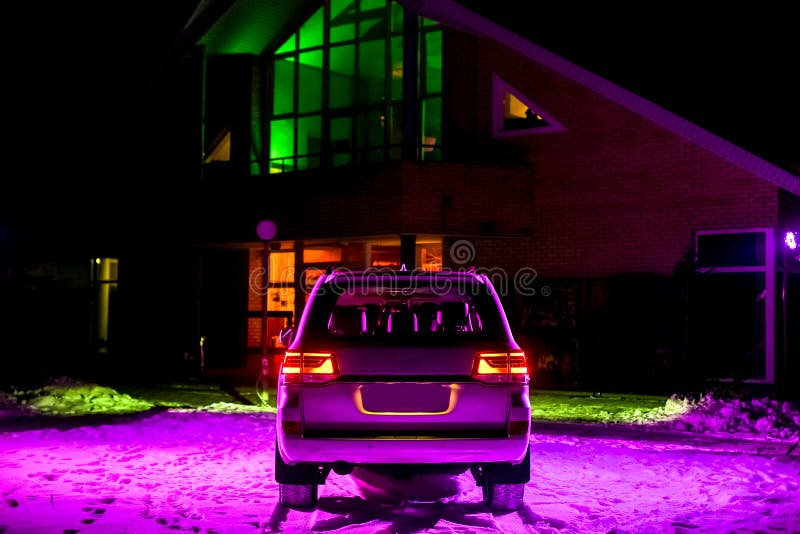 Modern White Off-roader at Night Under Purple Light Stock Image - Image ...