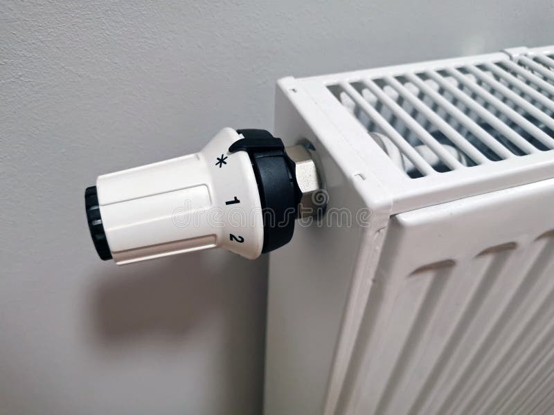 A Modern White Radiator with a Regulator, Controller and Thermostat ...