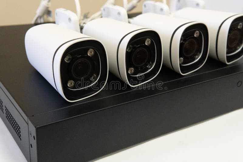 Modern White Security Cameras on the Table. the Concept of Video ...