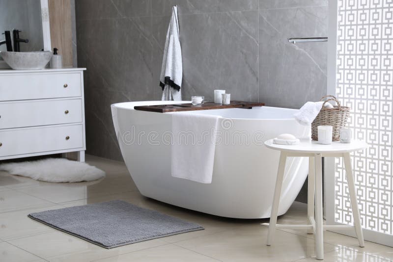 Modern White Tub and Chest of Drawers with Sink in Bathroom. Interior ...