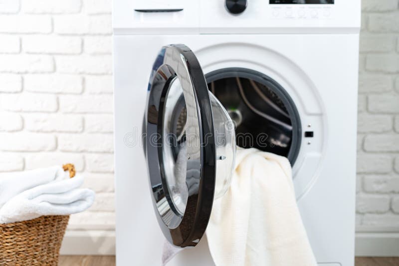 Modern White Washing Machine in a Laundry Room Close Up Stock Photo ...