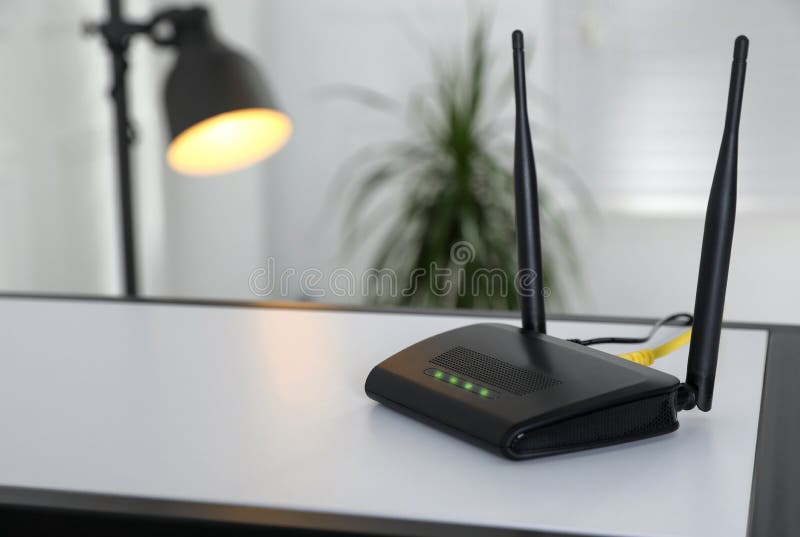 Modern Wi-Fi Router on Table Indoors. Space for Text Stock Image ...