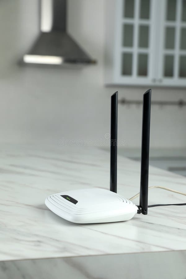 Modern Wi-Fi Router on White Marble Table in Kitchen Stock Photo ...