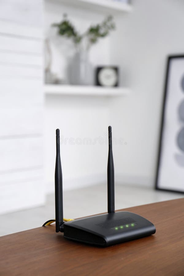 Modern Wi-Fi Router on Wooden Table Indoors Stock Photo - Image of ...