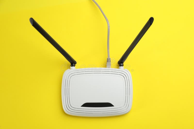 Modern Wi-Fi Router on Yellow Background, Top View Stock Photo - Image ...