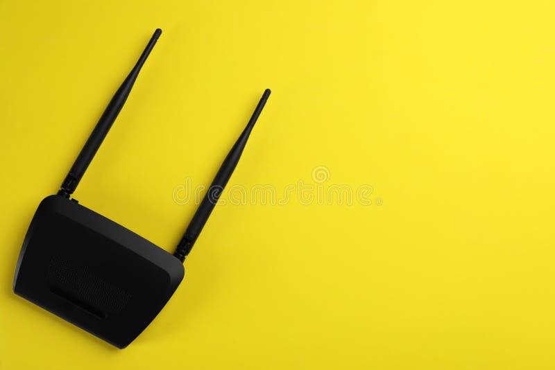 Modern Wi-Fi Router on Yellow Background, Top View. Space for Text ...