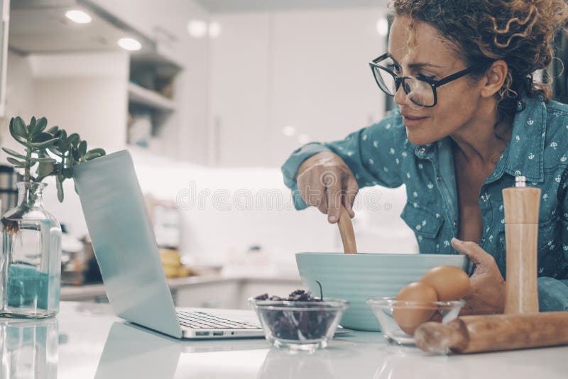 Modern Wife Prepare Breakfast or Lunch Using Computer and Online ...