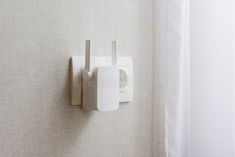 Modern WiFi Range Extender Plugged into Wall Outlet Stock Photo - Image ...