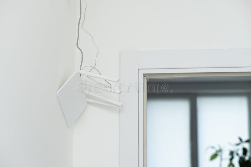 Modern WiFi Router on Light Wall in Home Office Stock Image - Image of ...