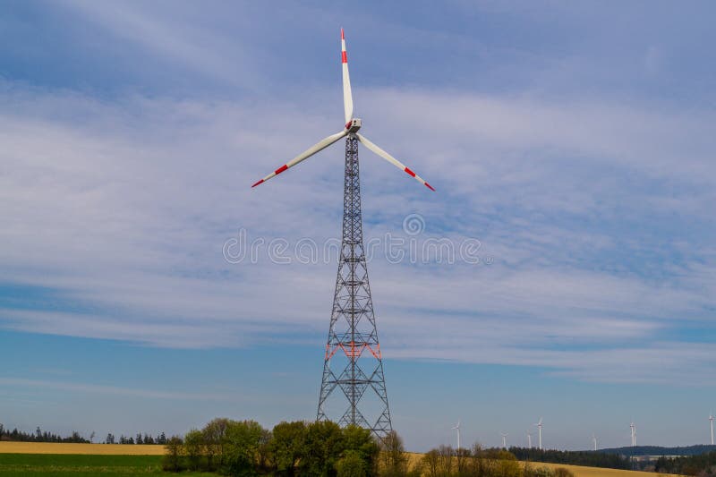 Modern windmill on a field stock image. Image of people - 266561611