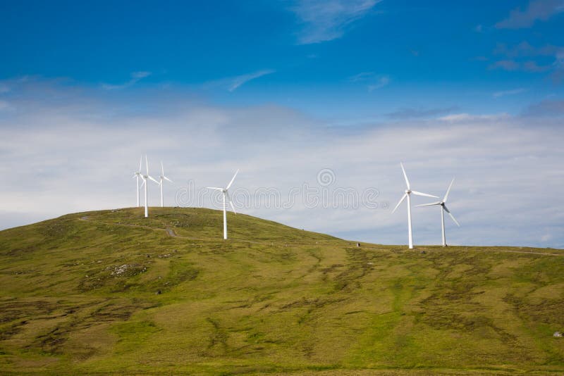 Modern Windmills on Rural Landscape Area Under Blue Sky Stock Photo ...
