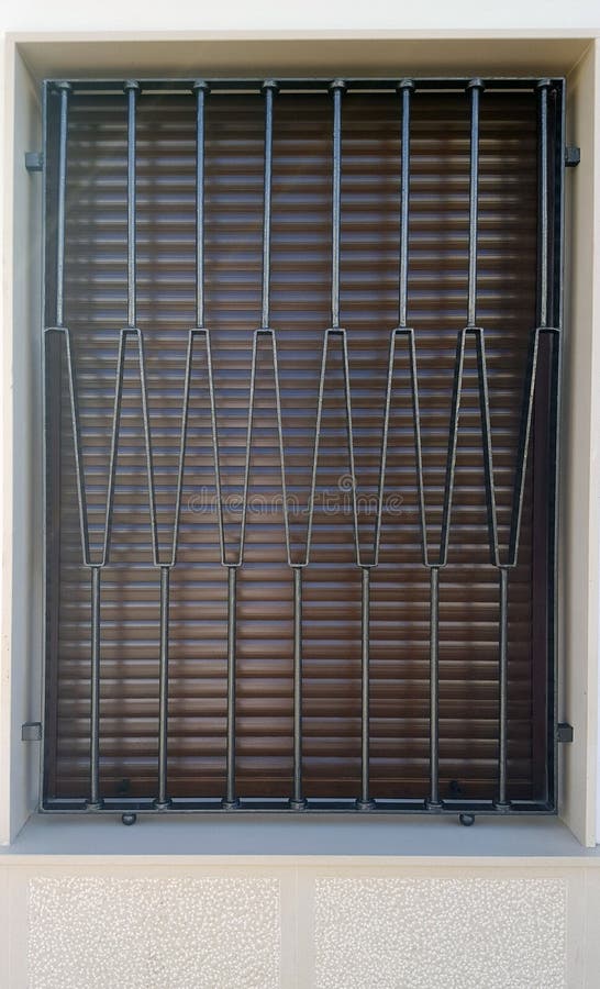 Modern Window with Security Shutters and Decorative Steel Bars. Stock ...
