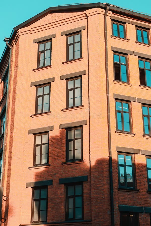 Modern Windows in Brown Frames on Red Brick Wall of Industrial Building ...
