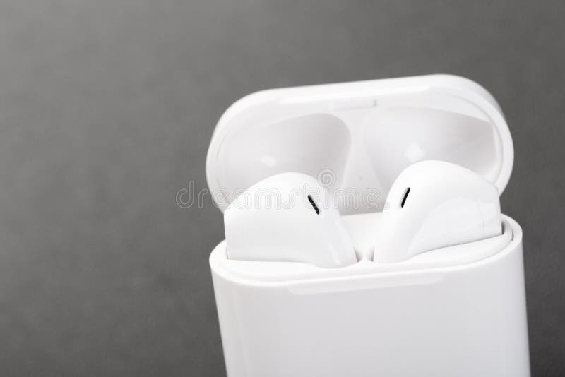 Modern Wireless Bluetooth Headphones with Charging Case on a Dark Black ...