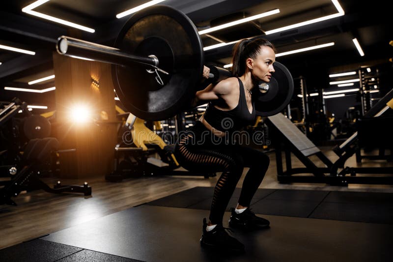 Modern Woman Posing Near Rowing Machine at the Gym. Functional Training ...