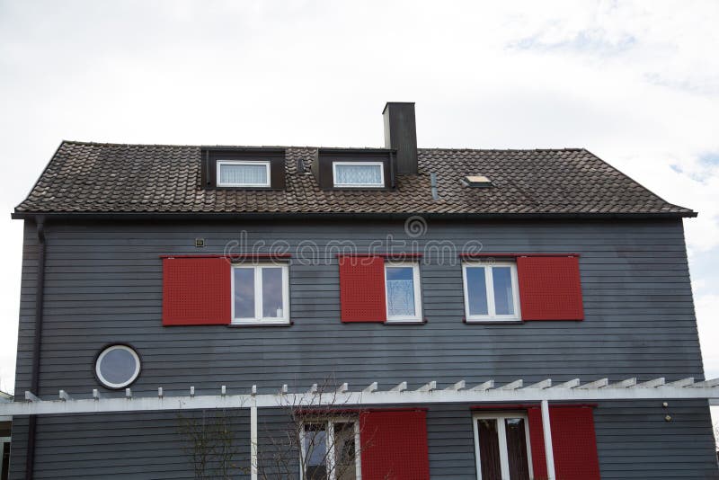 Modern Wooden House with Red Shutters Stock Photo - Image of glass ...