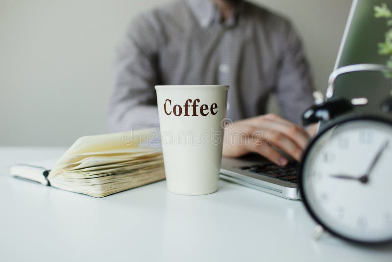 Modern Working Desk with Laptop Coffee and Alarm Clock Stock Photo ...