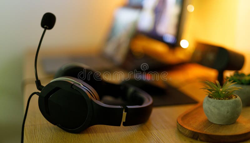 Modern Workplace. Gaming Headset on a Computer Desk with Neon Light ...