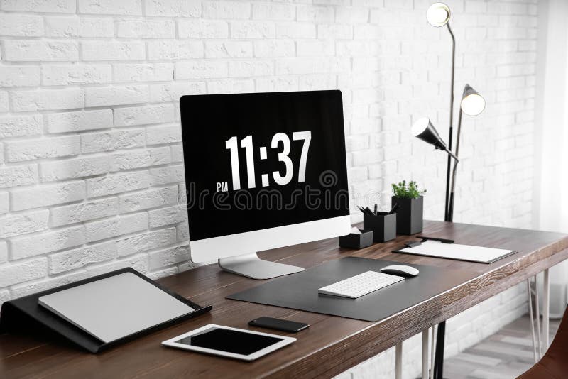 Modern Workplace Interior with Computer and Devices Near Brick Wall ...