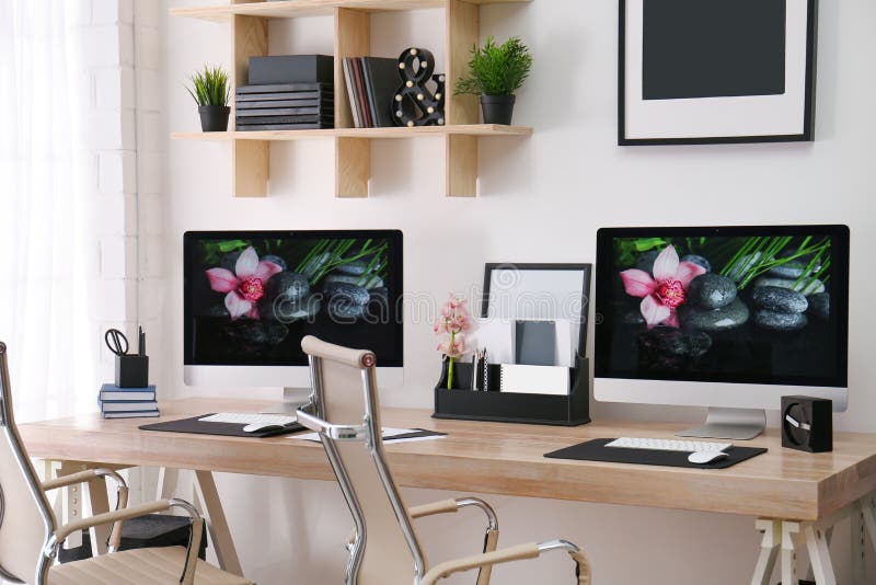 Modern Workplace with Large Desk and Computers in Room Stock Image ...