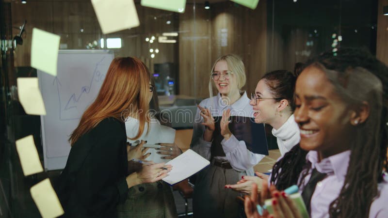 A Dynamic Team Collaboration is Taking Place in a Creative Workspace ...