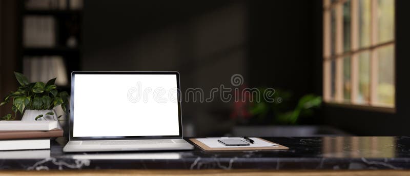 A Modern Workspace with a White-screen Laptop Mockup on a Black Marble ...