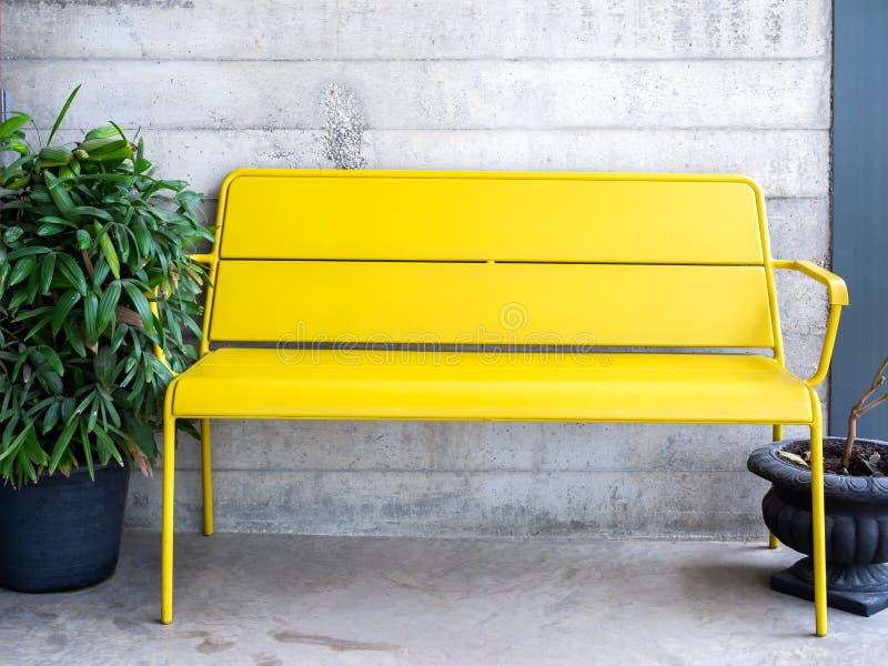 Modern Yellow Bench on Concrete Wall Background Stock Photo - Image of ...