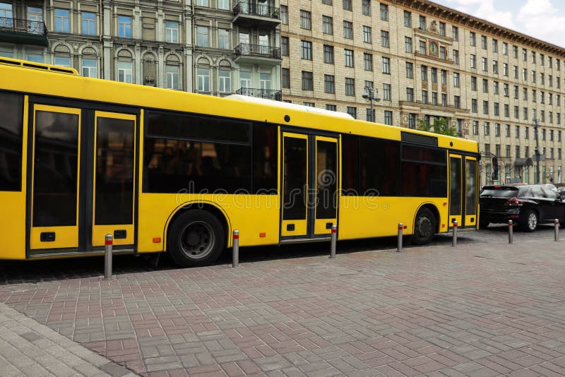Modern Yellow Bus with Passengers on City Street Stock Image - Image of ...