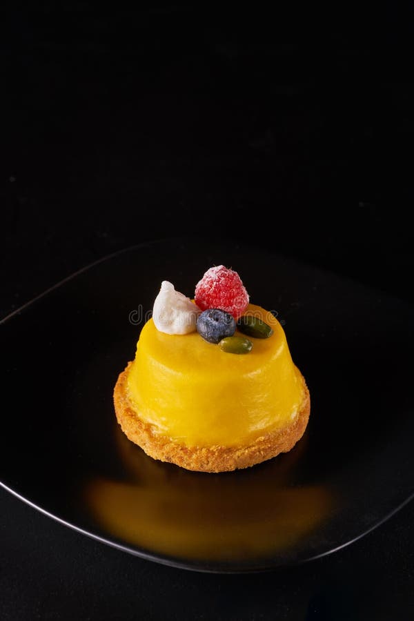 Mousse Dessert Covered with Yellow Glaze on Black Background Stock ...
