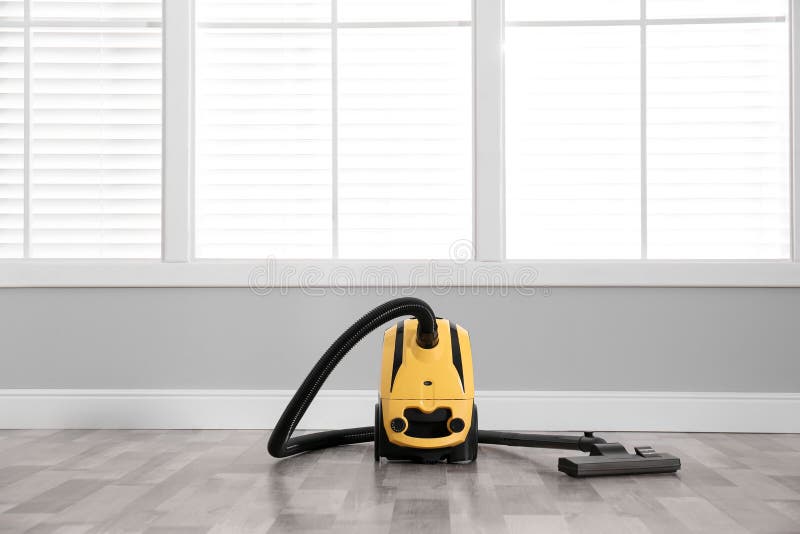 Modern Yellow Vacuum Cleaner on Floor Stock Image - Image of appliance ...