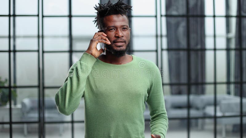 Modern Young Man with Mobile Phone in the Office. Stock Image - Image ...
