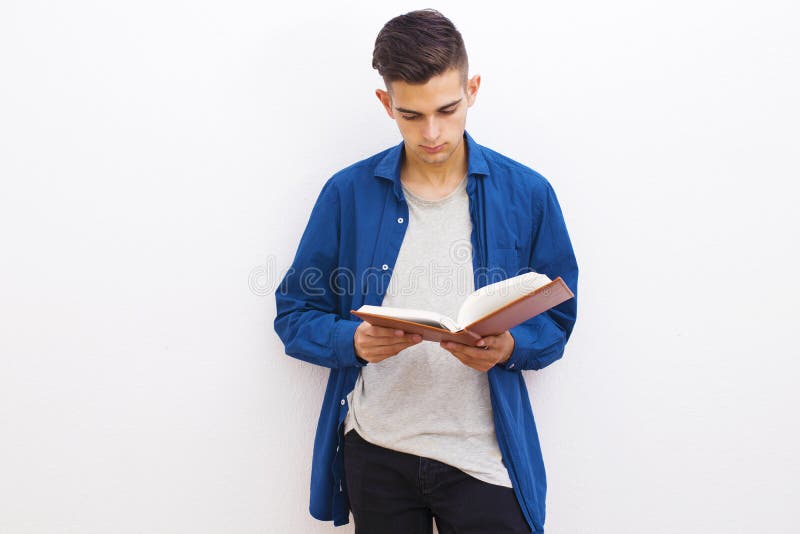 Young man reading the book stock photo. Image of beautiful - 107288498