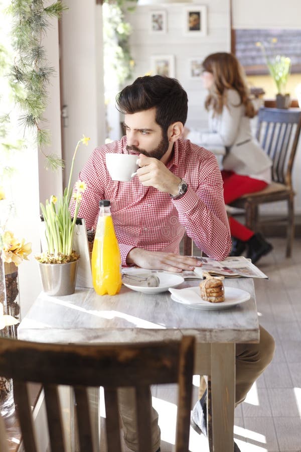 Modern Young Man Sitting in Coffee Shop Stock Photo - Image of male ...