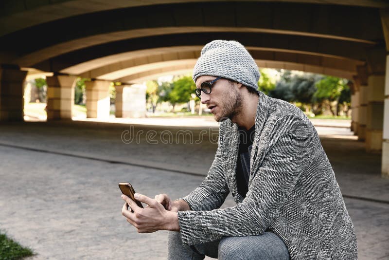 Modern Young Man with Smartphone Under Bridge Stock Image - Image of ...
