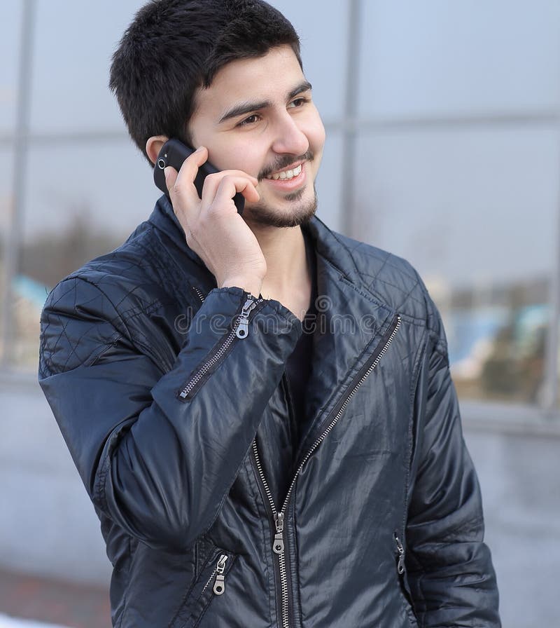 Young Man Talking on a Mobile Phone on the Street Stock Image - Image ...