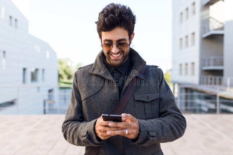 Modern Young Man Using His Mobile Phone in the Street. Stock Image ...