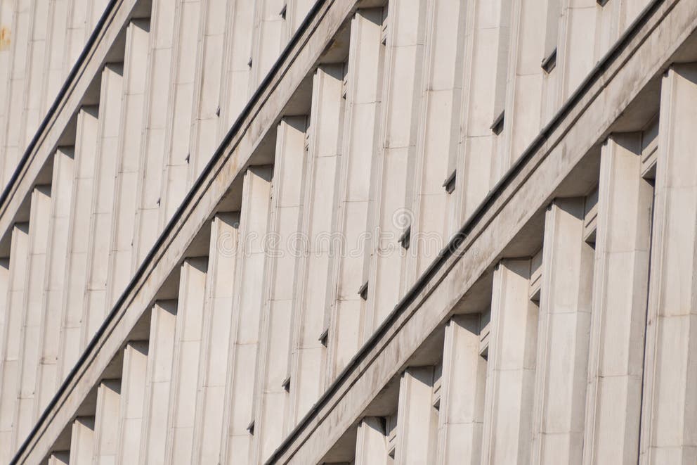 A Modernist Facade with Repeating Vertical Concrete Elements, Creating ...