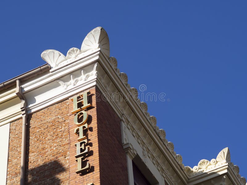 Modernist Hotel Lettering with Red Brick Wall Stock Image - Image of ...