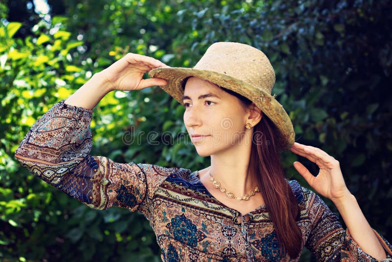 A Modest and Beautiful Woman in a Straw Hat Stock Photo - Image of face ...
