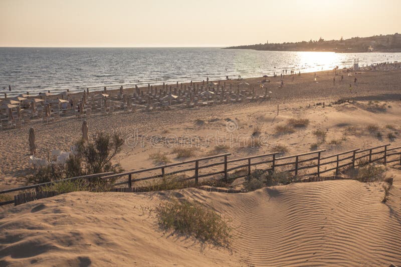 Modica Beach at sunset stock photo. Image of building - 161171540