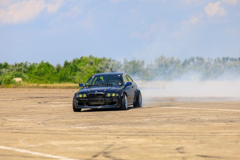 Black BMW Drifting with Intense Smoke Effect on Open Track. July 2 ...
