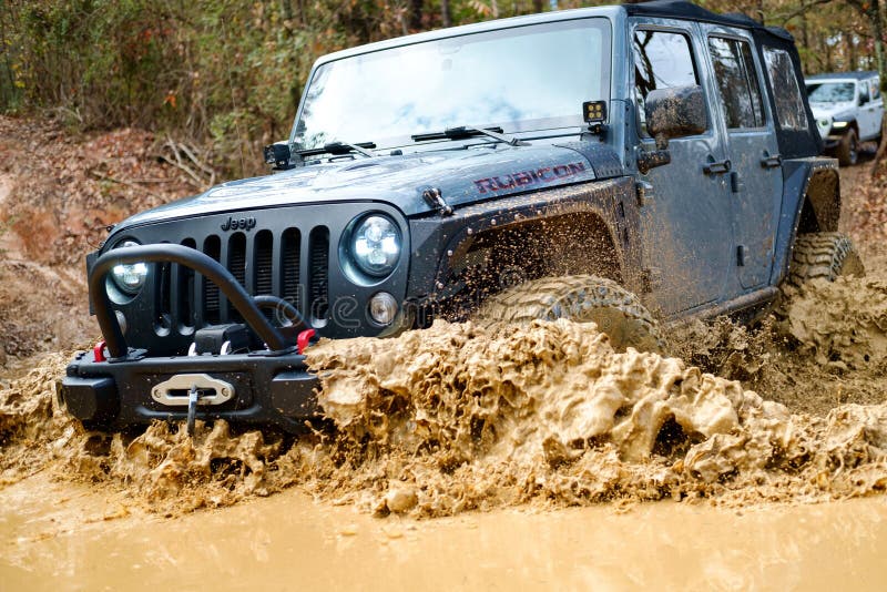 Modified Jeep Rubicon JK Driving through Mud. Editorial Photography ...