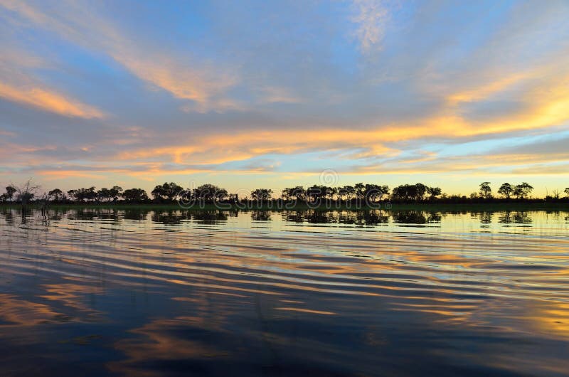 Mokoro in the Okavango Delta at Sunset, Botswana Stock Image - Image of ...